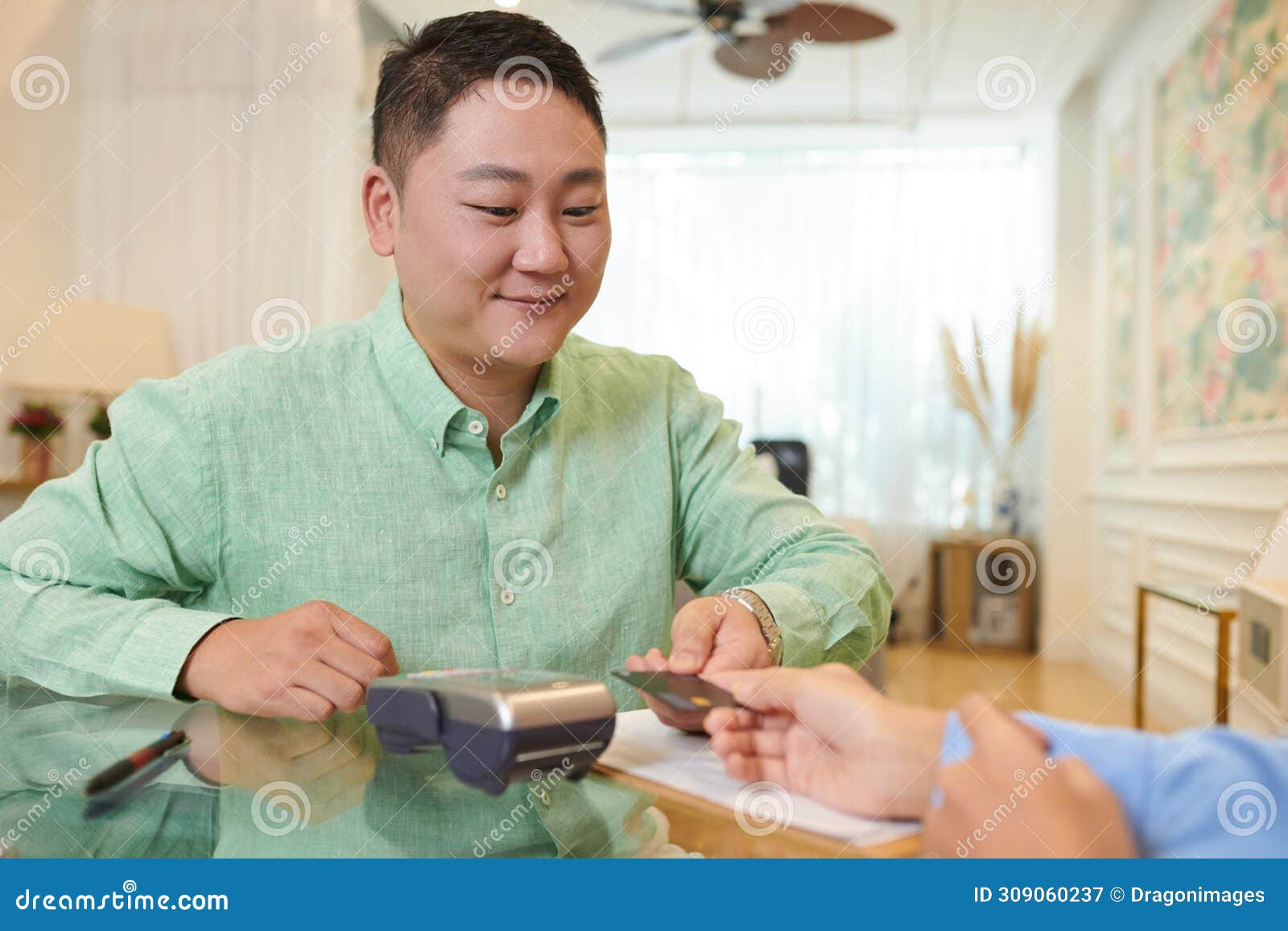 Smiling Receptionist Accepting Payment Stock Image - Image of accept ...