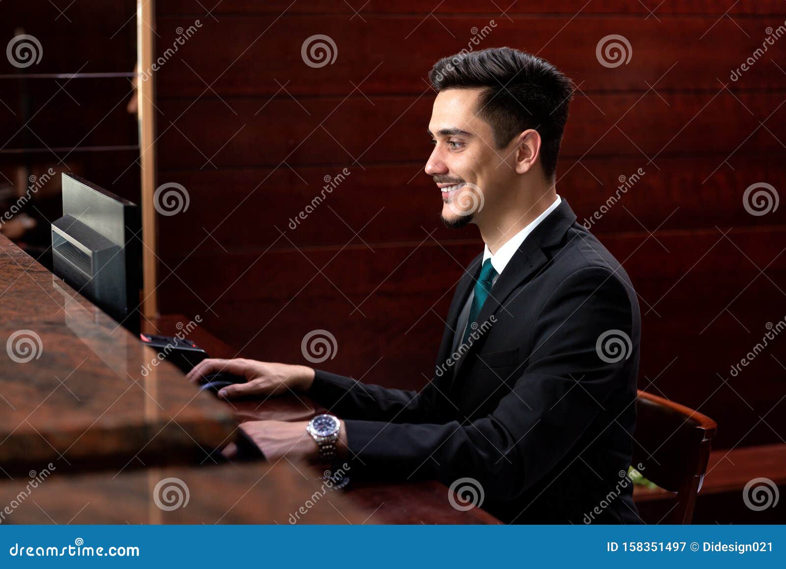 A Smiling Receptionist at His Desk Stock Image - Image of guest, happy ...