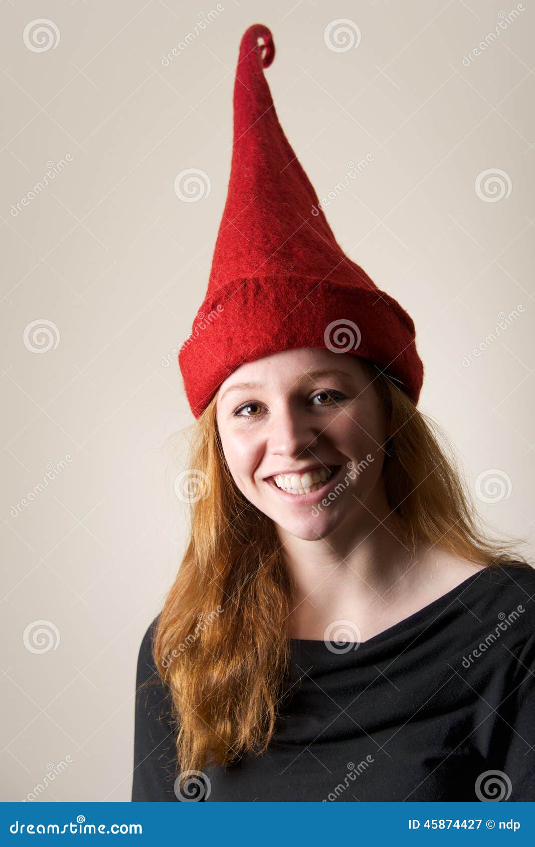 Smiling Redhead in Tall Red Pointed Hat Stock Image - Image of portrait ...