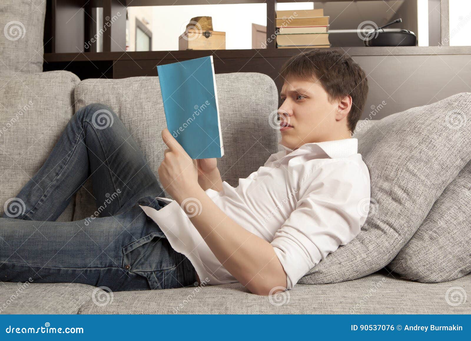 Smiling Relaxed Man Reading a Book Stock Photo - Image of male, adult ...