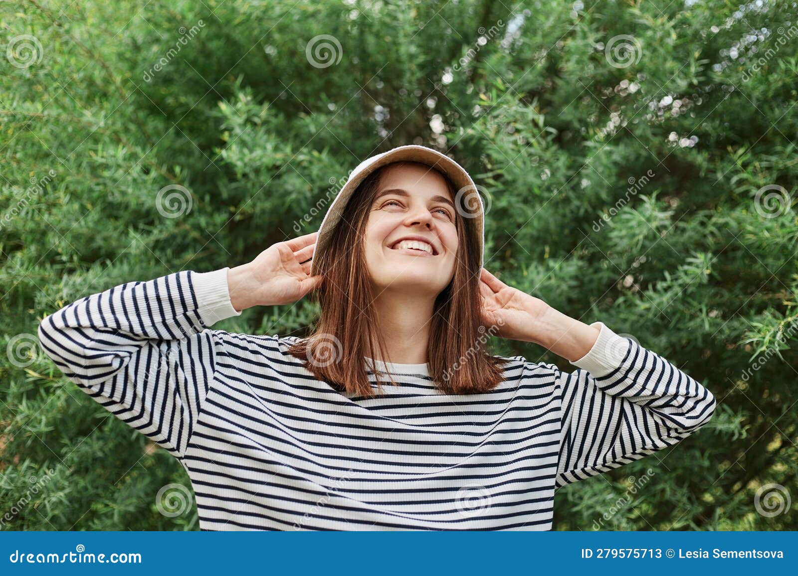 Smiling Relaxed Woman Wearing Striped Shirt And Panama Standing With
