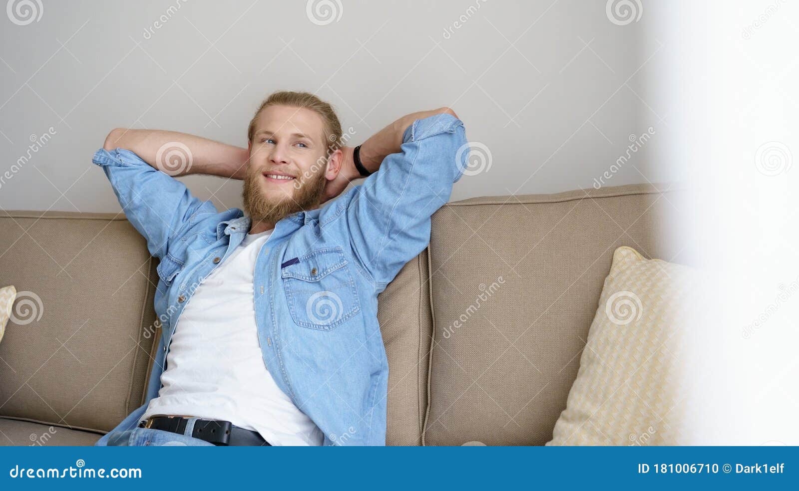 Smiling Relaxed Young Man Chill on Comfortable Couhc Looking Away ... Smiling Relaxed Young Man Chill on Comfortable Couhc Looking Away ...