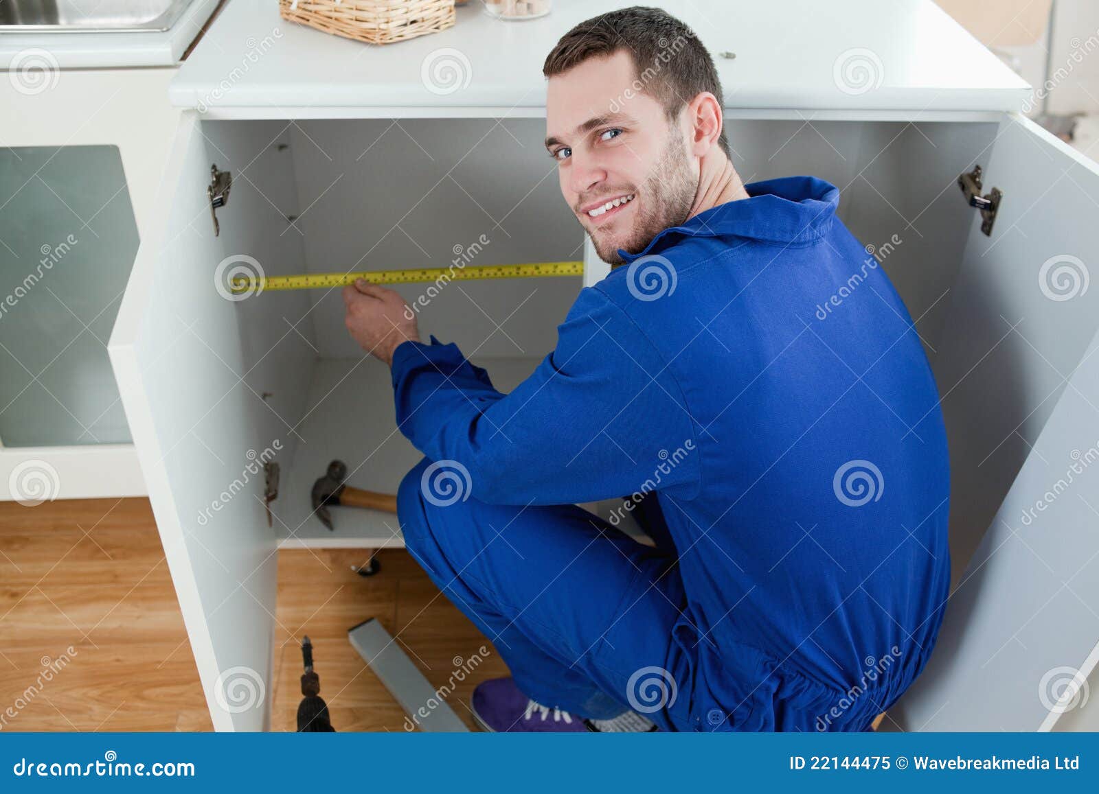 Smiling Repair Man Measuring Something Stock Image - Image of ...