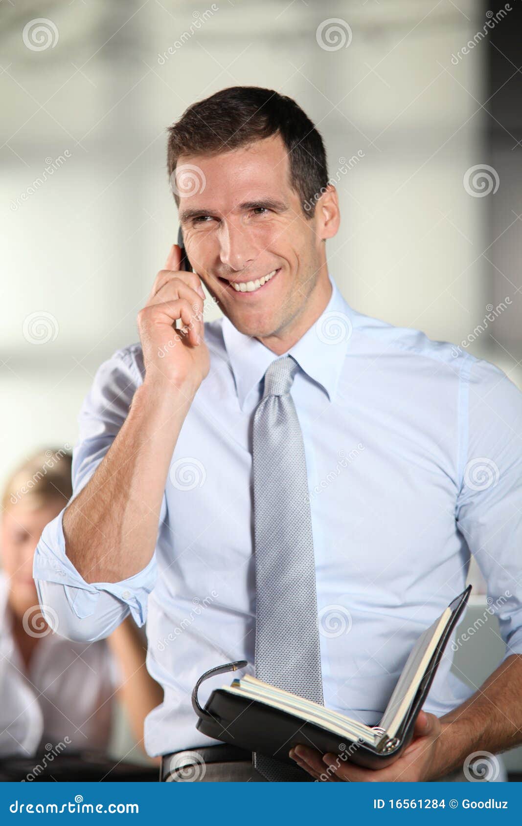 Smiling salesman stock photo. Image of cellphone, smiling - 16561284