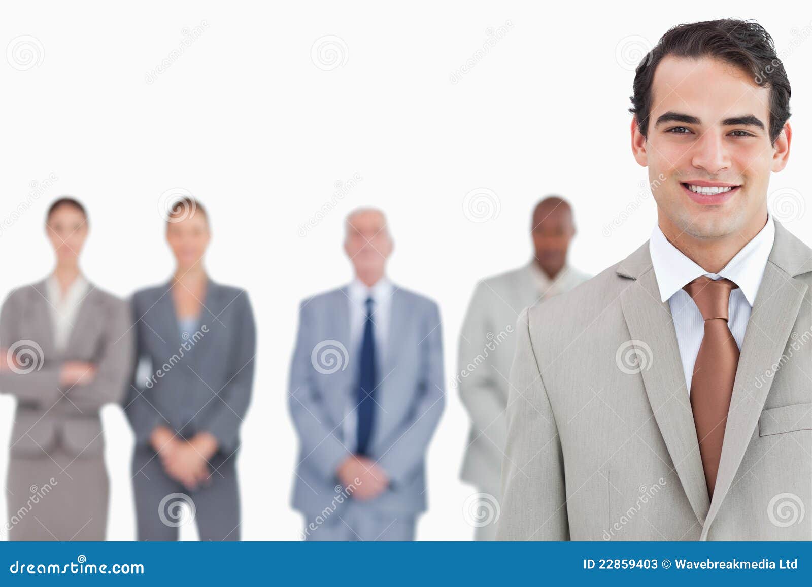 Smiling Salesman with Colleagues Behind Him Stock Image - Image of ...