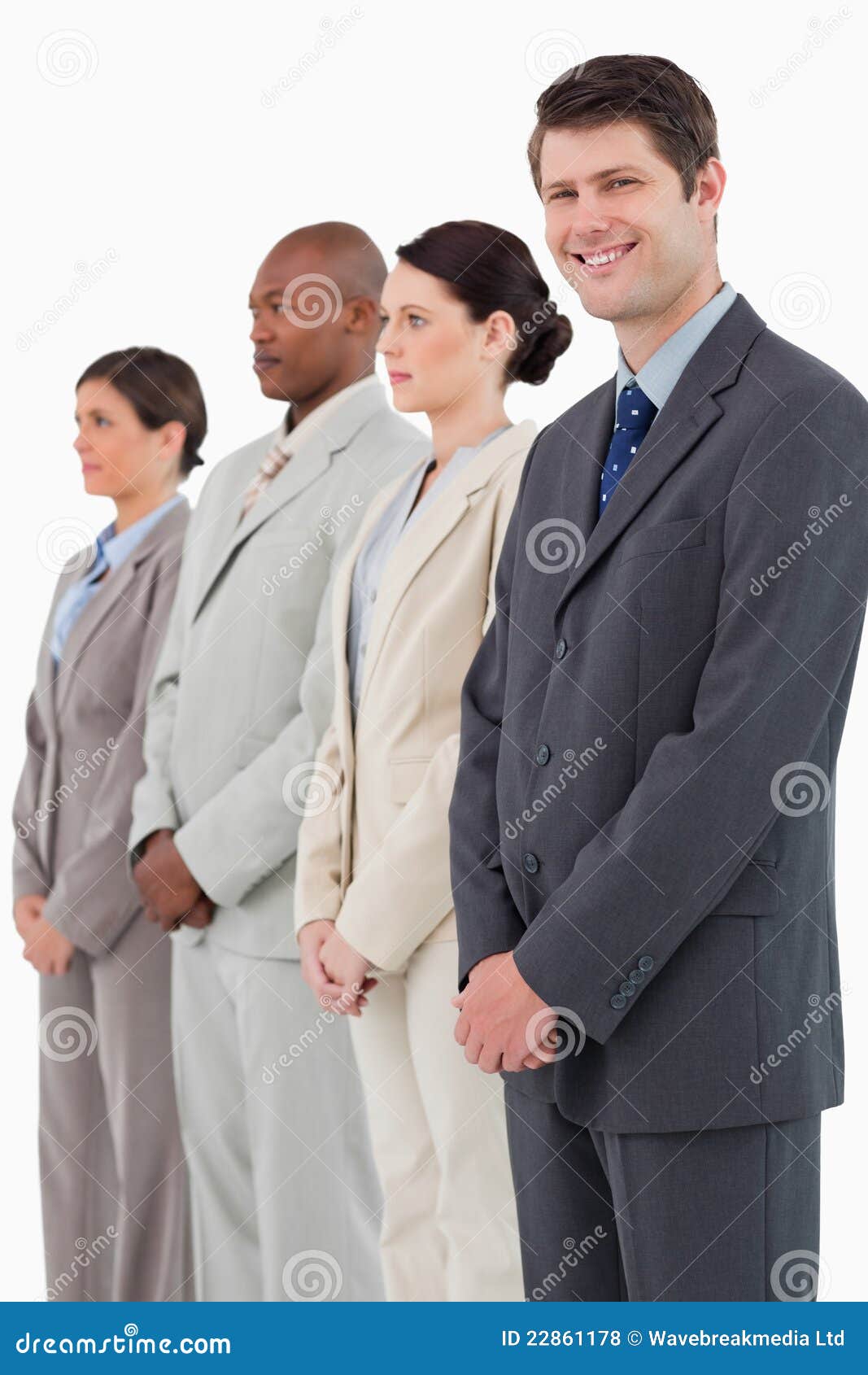 Smiling Salesman Standing Next To His Colleagues Stock Photo - Image of ...