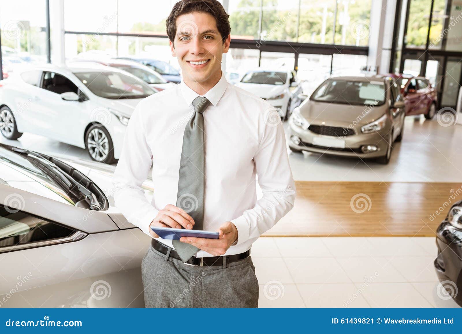 Smiling Salesman Using Tablet Near a Car Stock Image - Image of ... Smiling Salesman Using Tablet Near a Car Stock Image - Image of ...