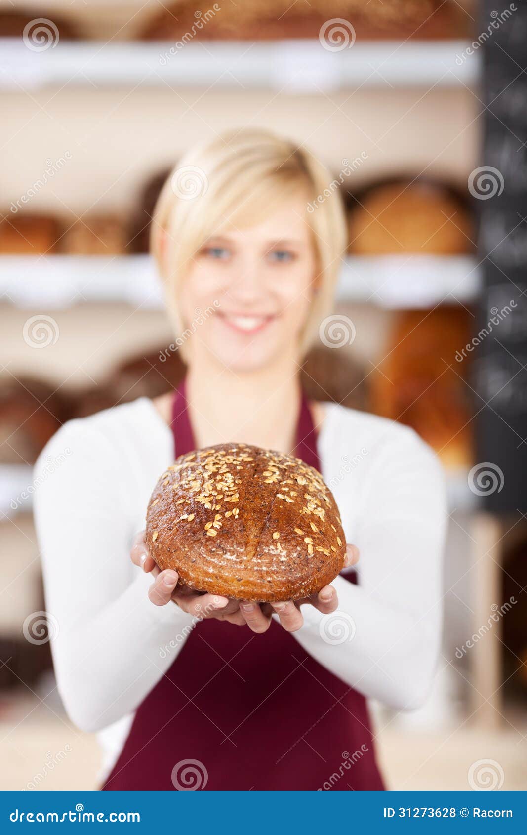 Smiling Saleswoman Showing Bread in Her Hands Stock Photo - Image of ...