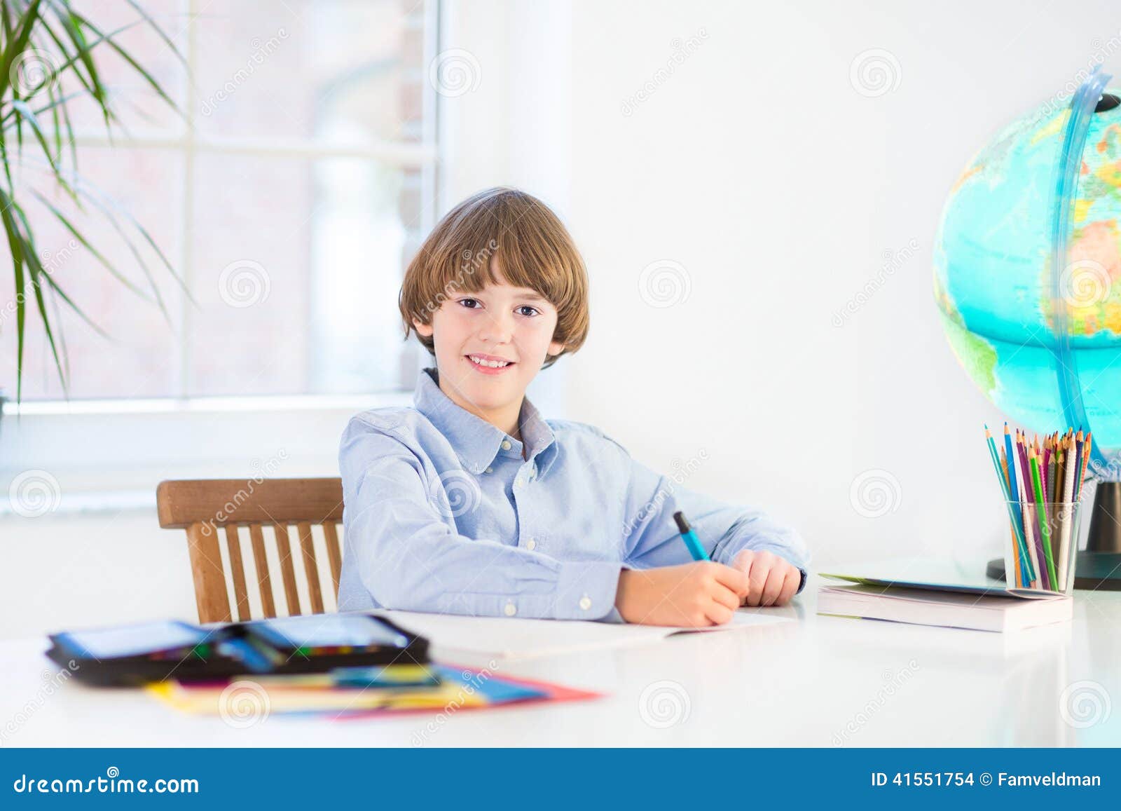 Smiling School Boy Doing His Homework Stock Photo - Image of care ...