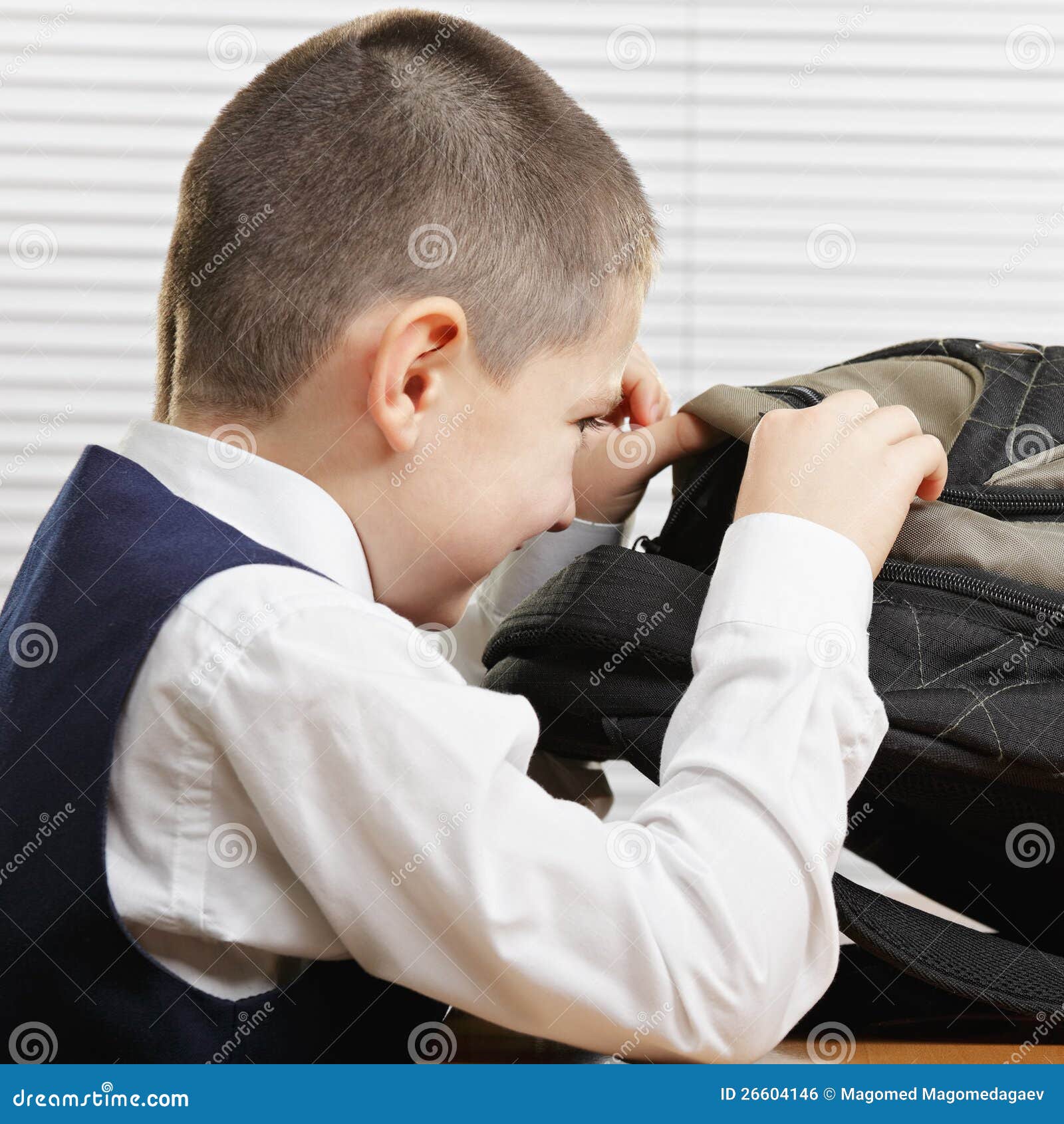 Smiling Schoolboy Looking into Backpack Stock Photo - Image of person ...