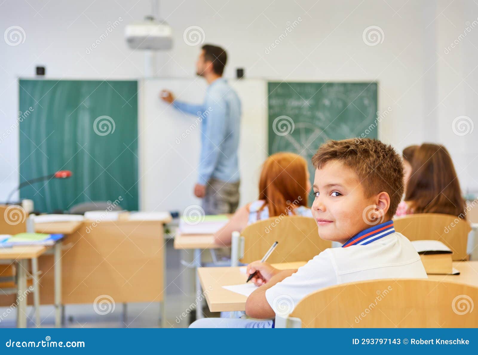 Smiling Schoolboy Sitting on Bench in Classroom Stock Image - Image of ...