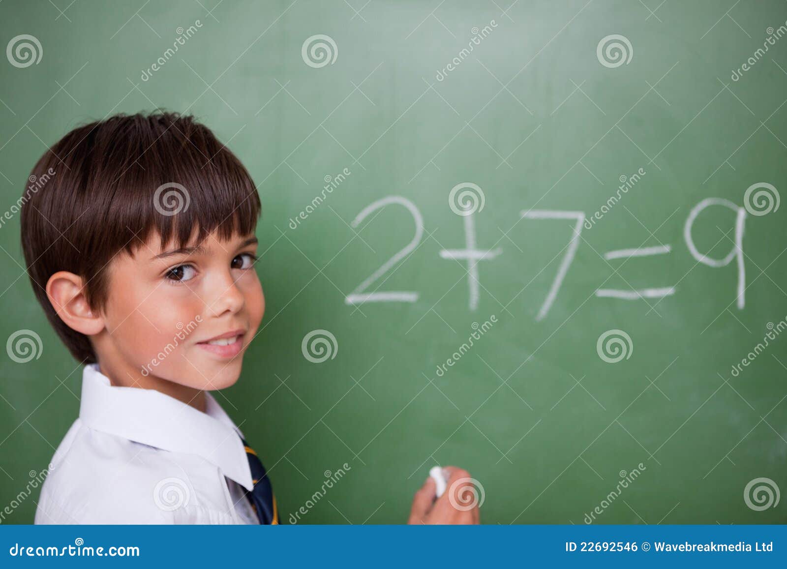 Smiling Schoolboy Writing an Addition Stock Photo - Image of ...