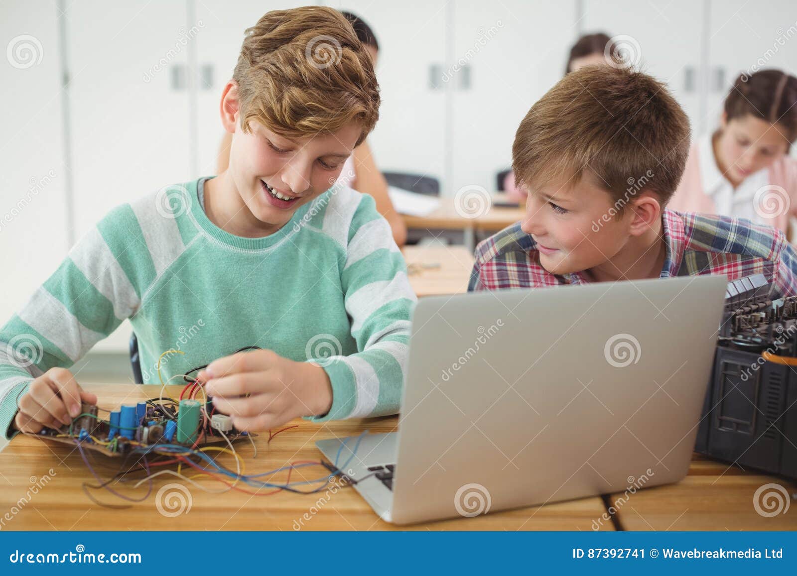 Smiling Schoolboys Working On Electronical Project In Classroom Royalty ...