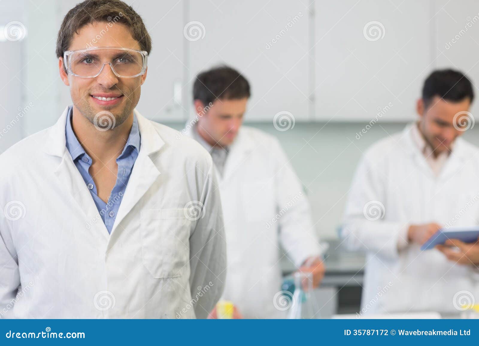 Smiling Scientist with Colleagues at Work in the Lab Stock Photo ...