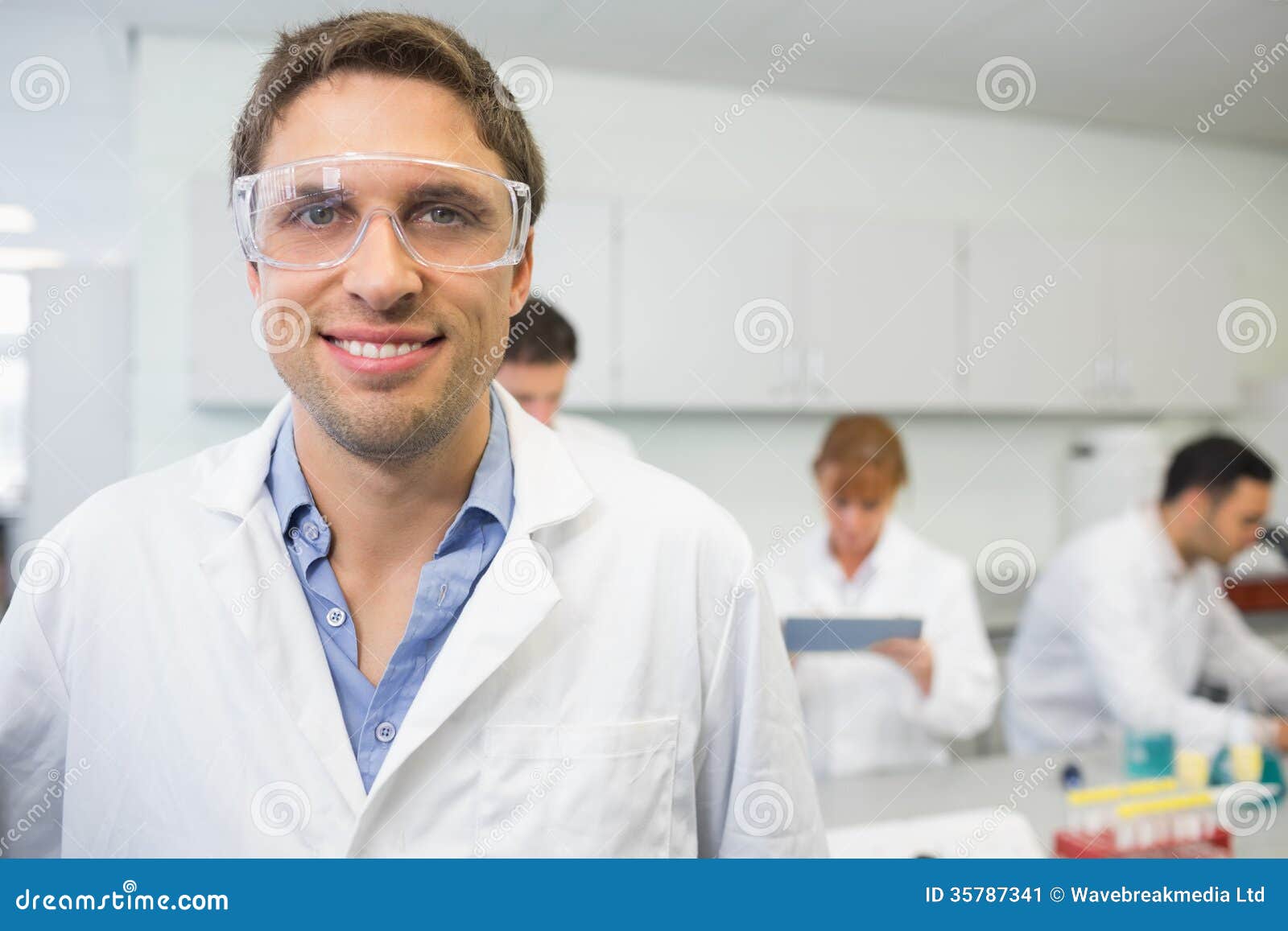 Smiling Scientist with Colleagues at Work in the Lab Stock Image ...