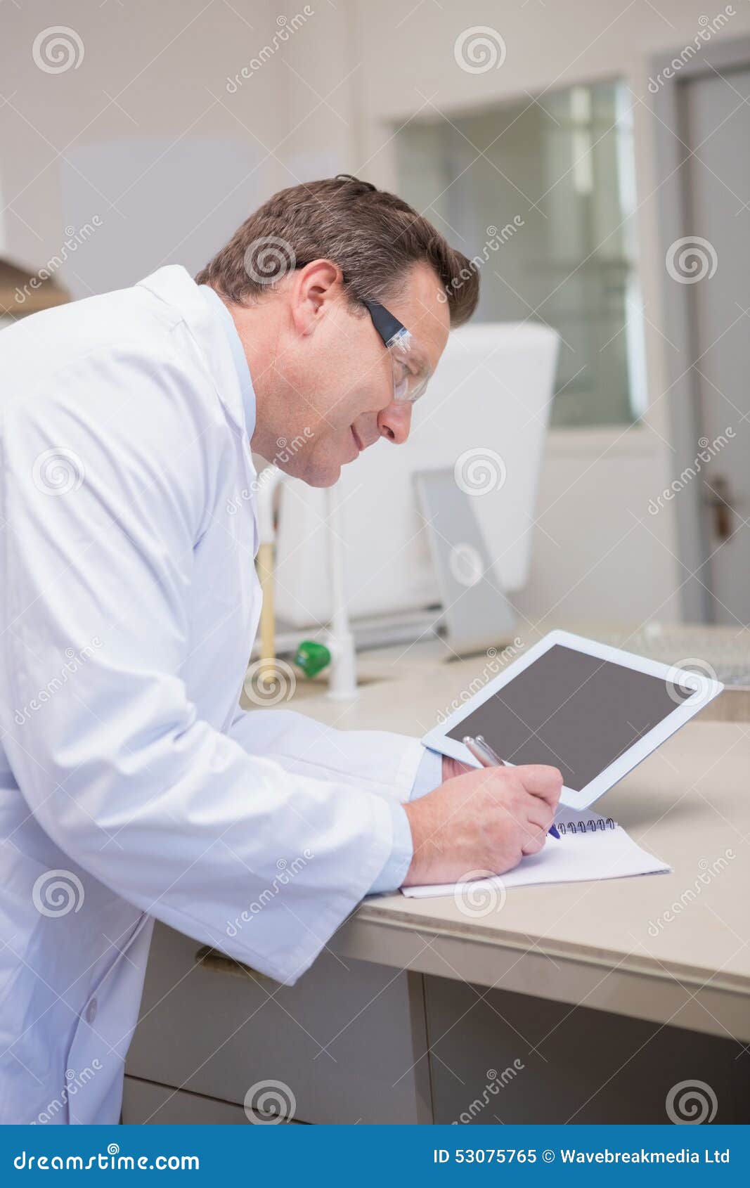 Smiling Scientist Holding Tablet Writing on Notebook Stock Image ...