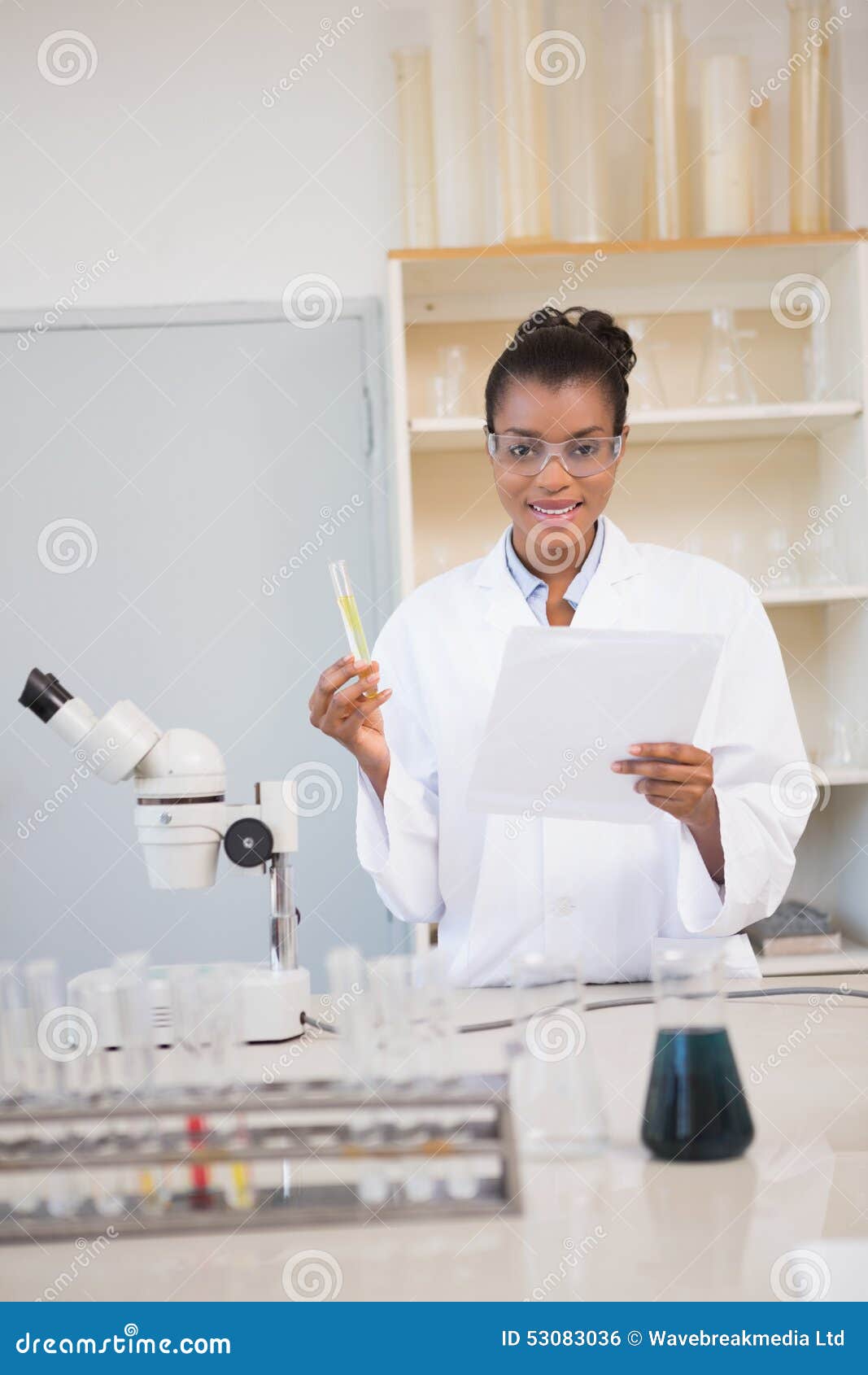Smiling Scientist Looking at Camera and Holding Paper Stock Photo ...