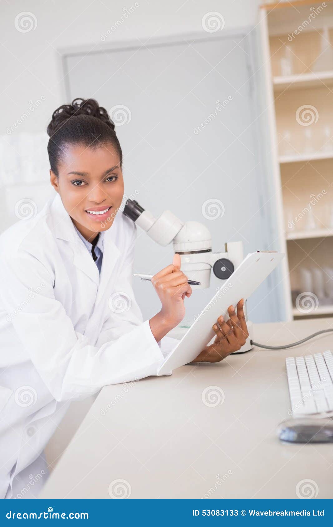 Smiling Scientist Looking at Camera and Taking Notes Stock Image ...