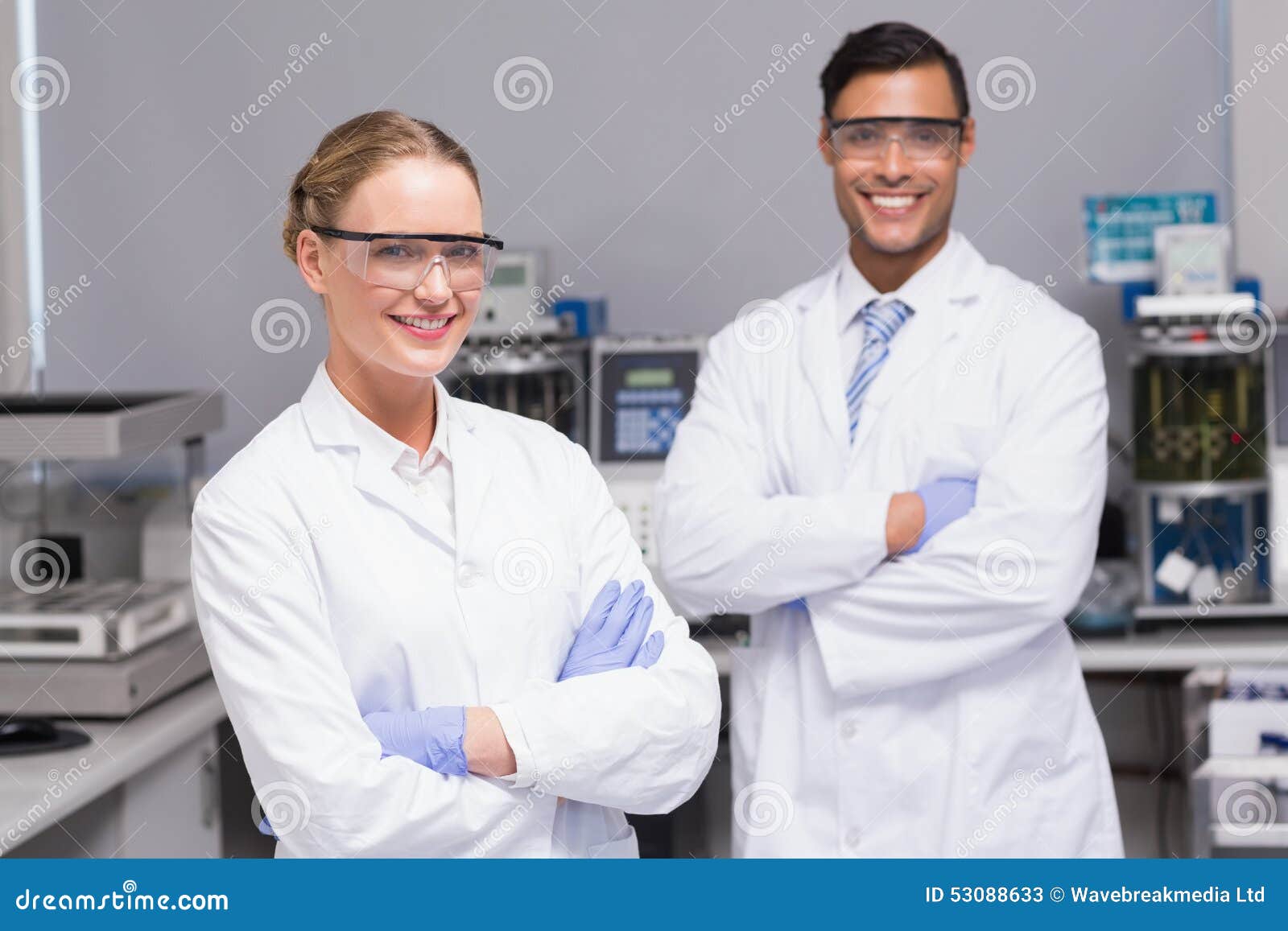 Scientists Looking At A Slide Under A Microscope Royalty-Free Stock ...