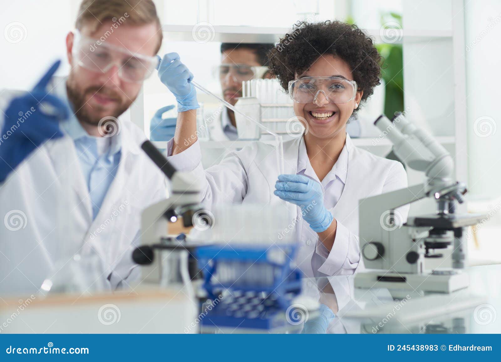 Smiling Scientists Looking at Camera Arms Crossed in Laboratory Stock ...