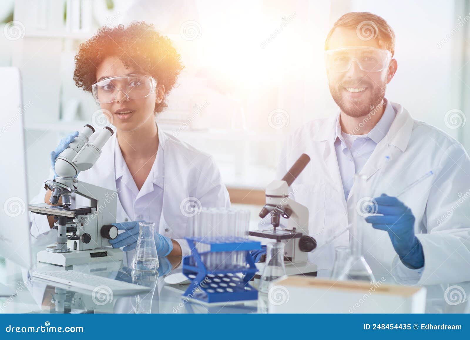 Smiling Scientists Looking at Camera Arms Crossed in Laboratory Stock ...