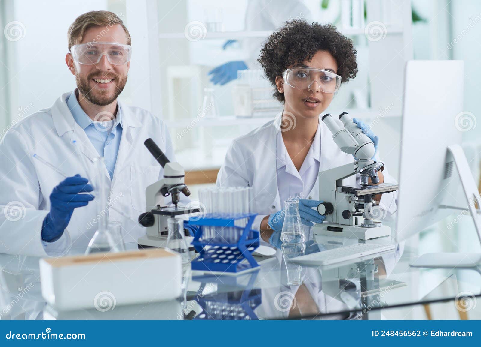 Smiling Scientists Looking at Camera Arms Crossed in Laboratory Stock ...