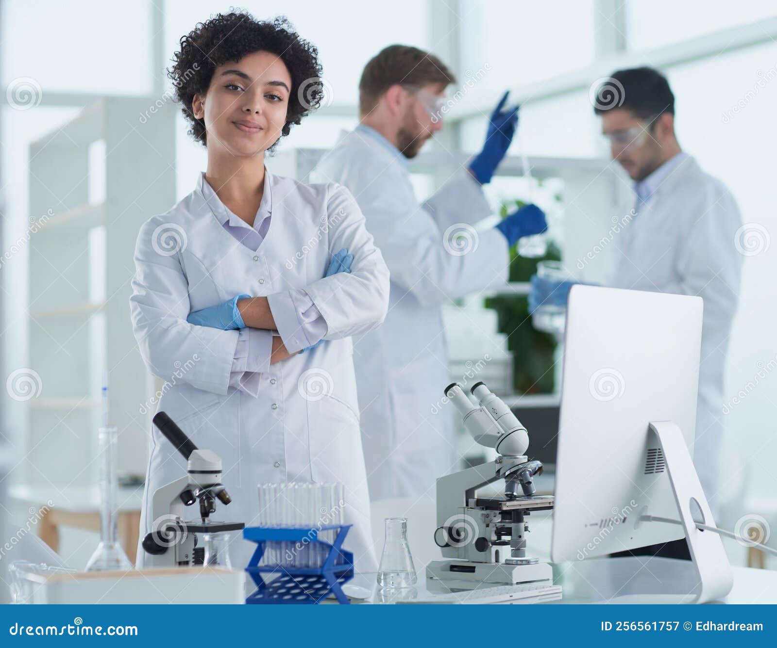 Smiling Scientists Looking at Camera Arms Crossed in Laboratory Stock ...