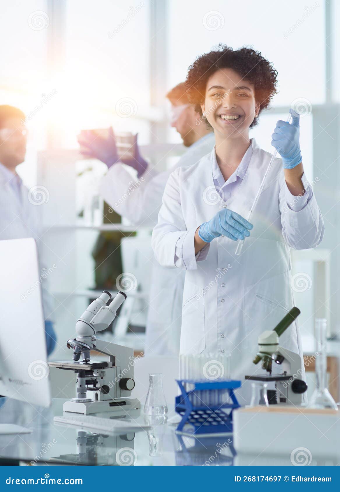 Smiling Scientists Looking at Camera Arms Crossed in Laboratory Stock ...