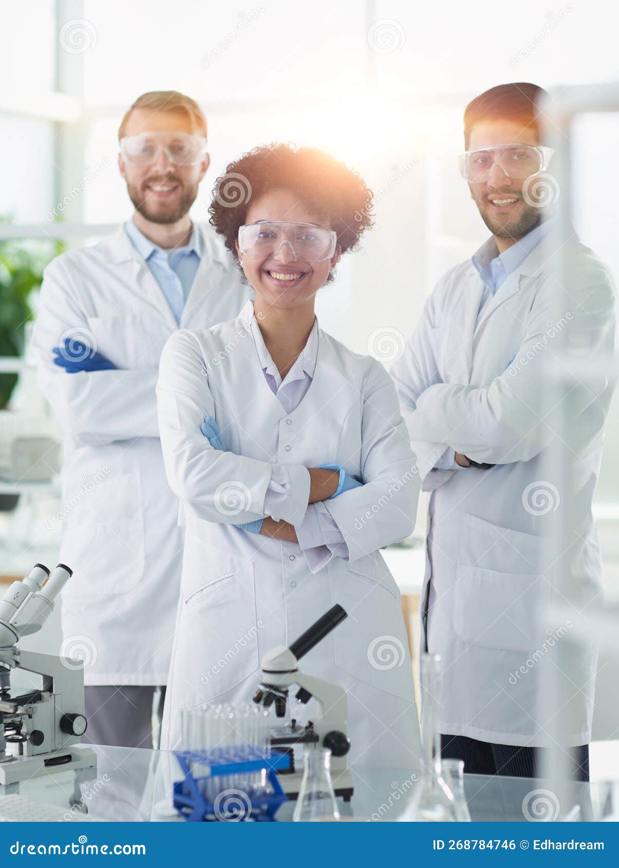 Smiling Scientists Looking at Camera Arms Crossed in Laboratory Stock ...