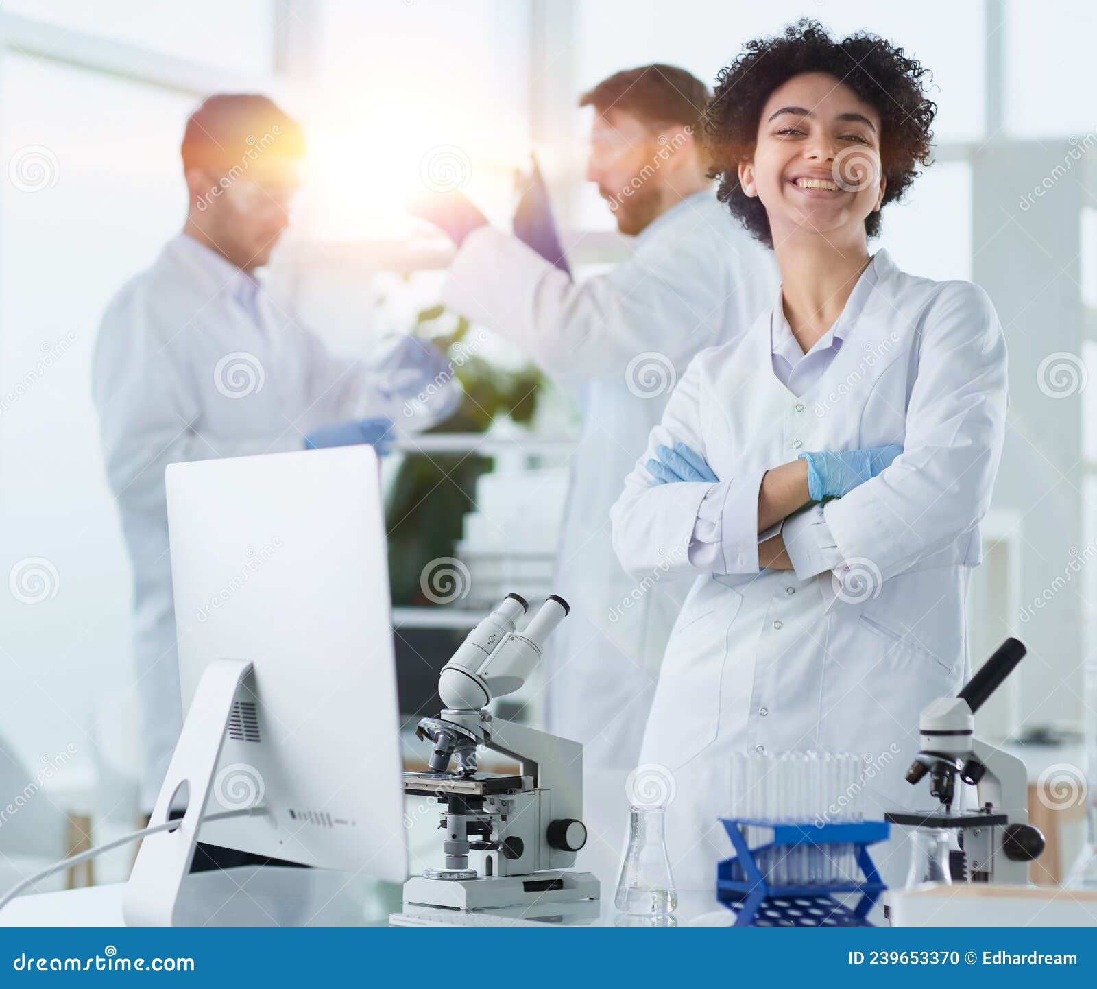 Smiling Scientists Looking at Camera Arms Crossed in Laboratory Stock ...