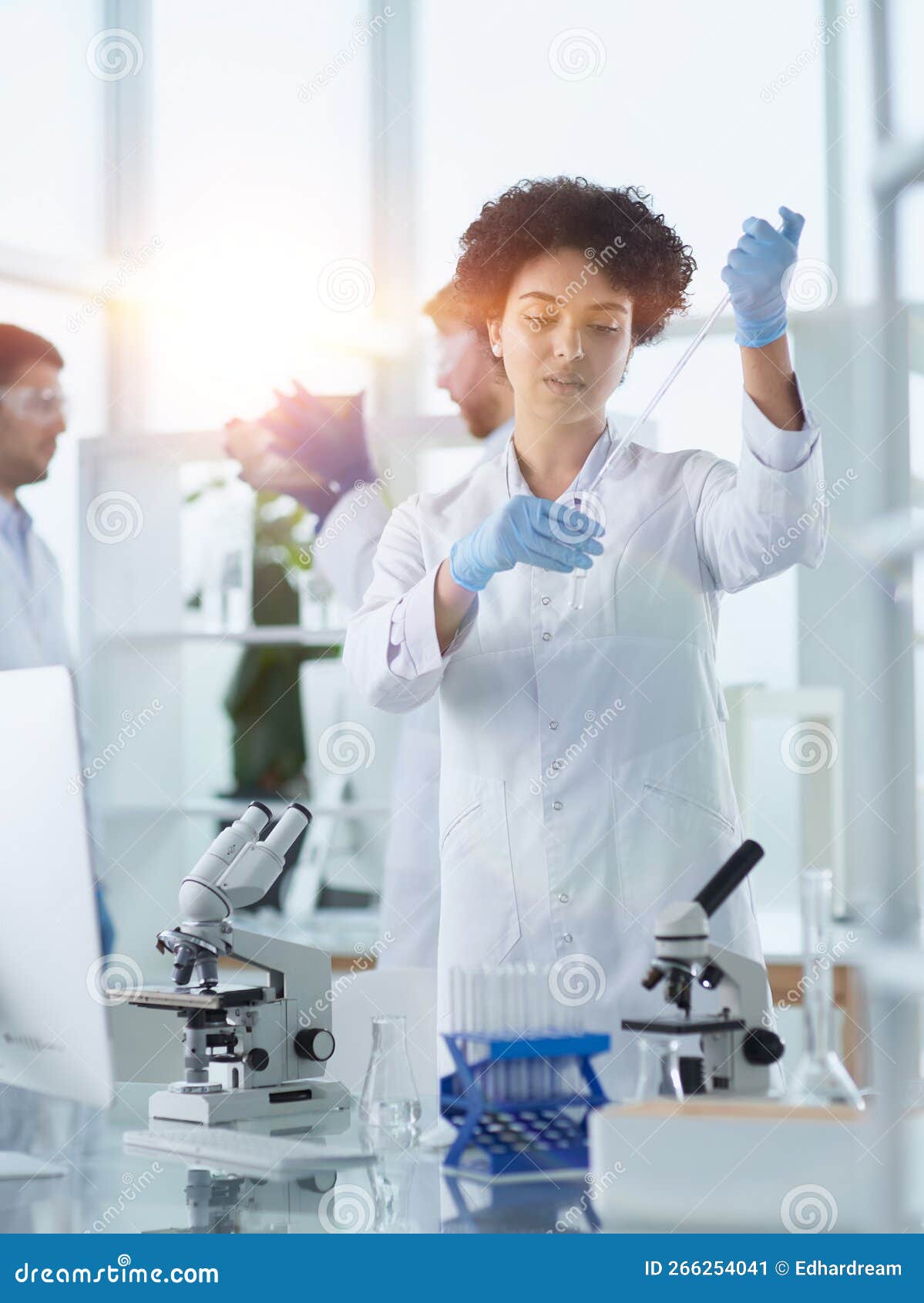 Smiling Scientists Looking at Camera Arms Crossed in Laboratory Stock ...