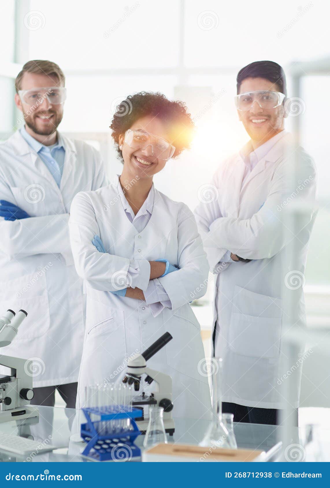 Smiling Scientists Looking at Camera Arms Crossed in Laboratory Stock ...