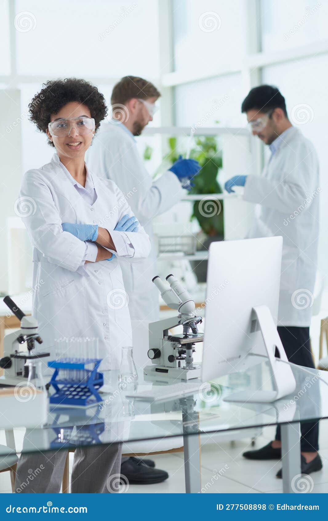 Smiling Scientists Looking at Camera Arms Crossed in Laboratory Stock ...
