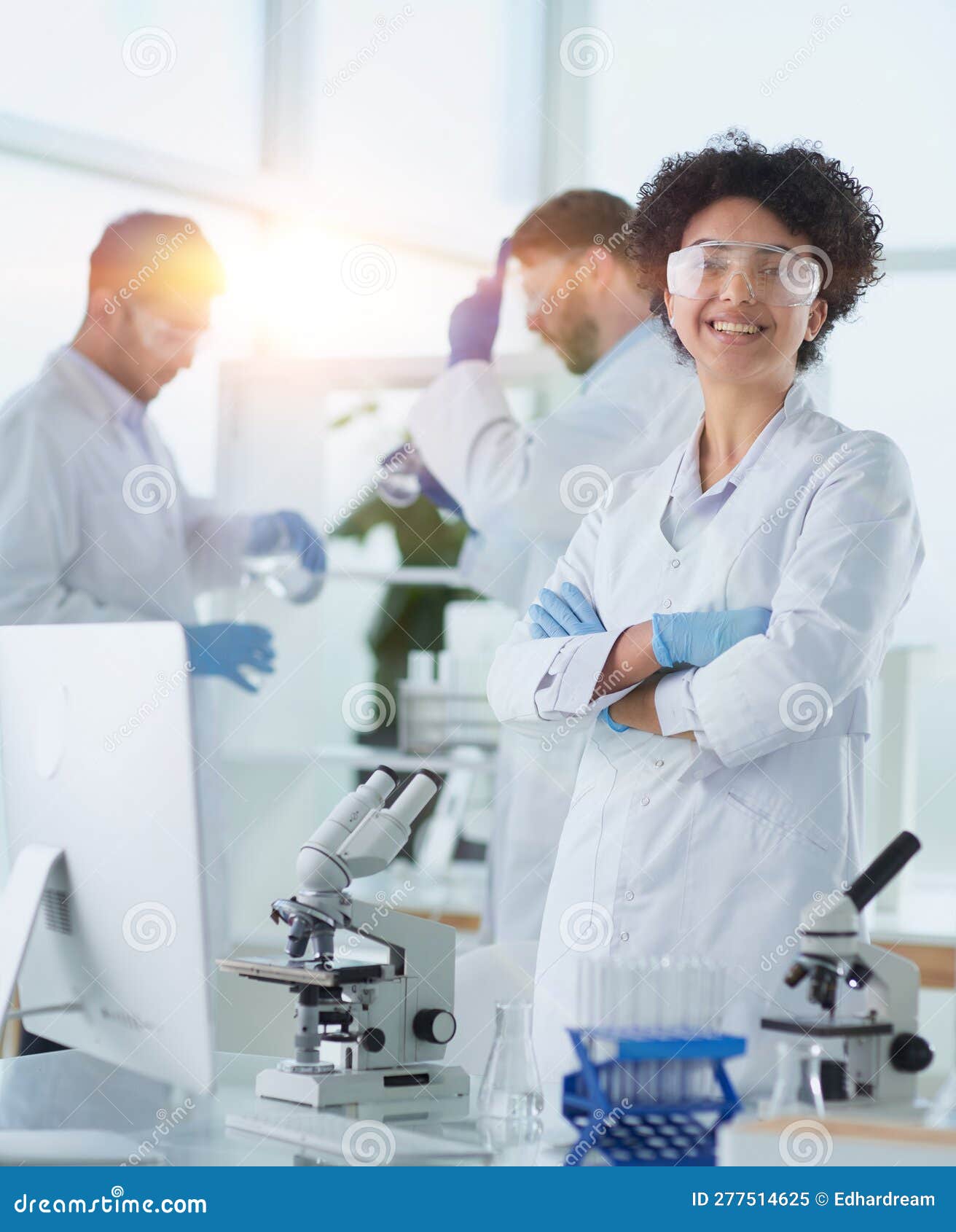 Smiling Scientists Looking at Camera Arms Crossed in Laboratory Stock ...