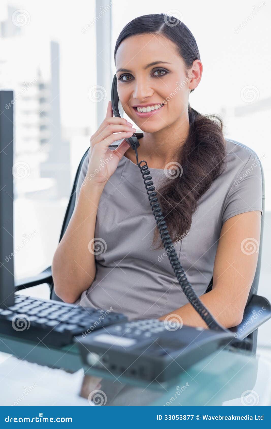 Smiling Secretary Answering Land Line Stock Image - Image of business ...
