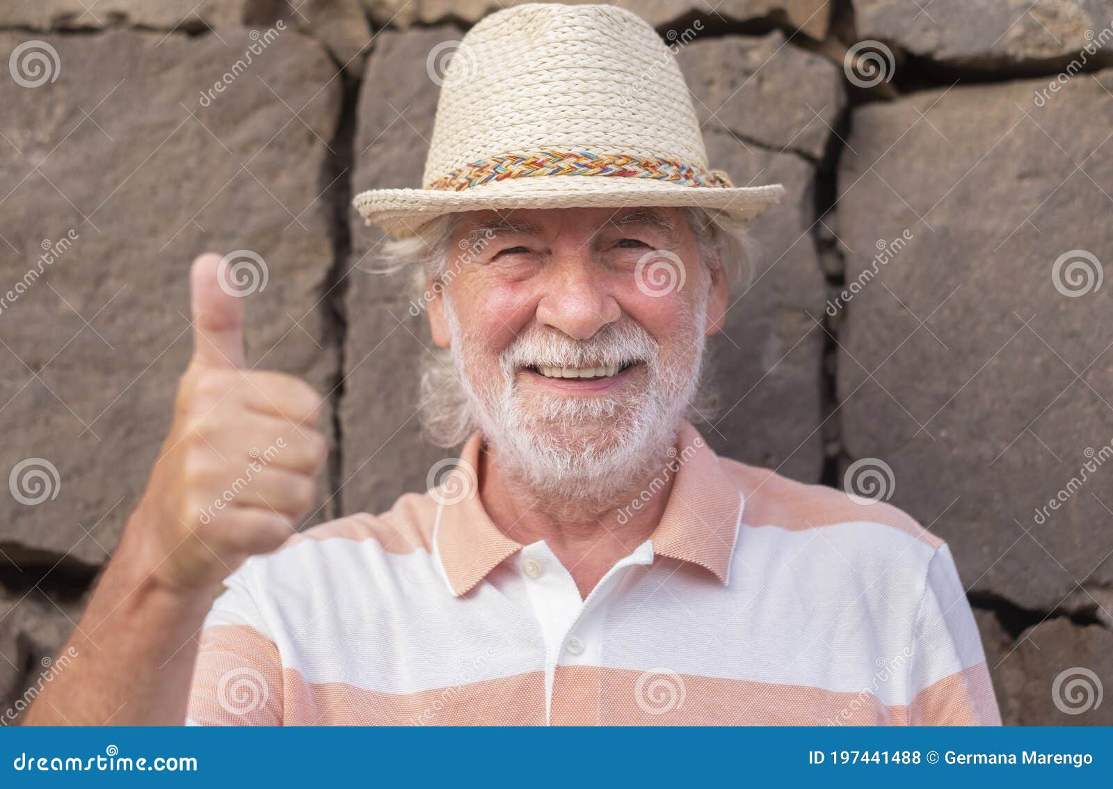 Smiling Senior Bearded Man With White Hair And Straw Hat Making Ok Sign