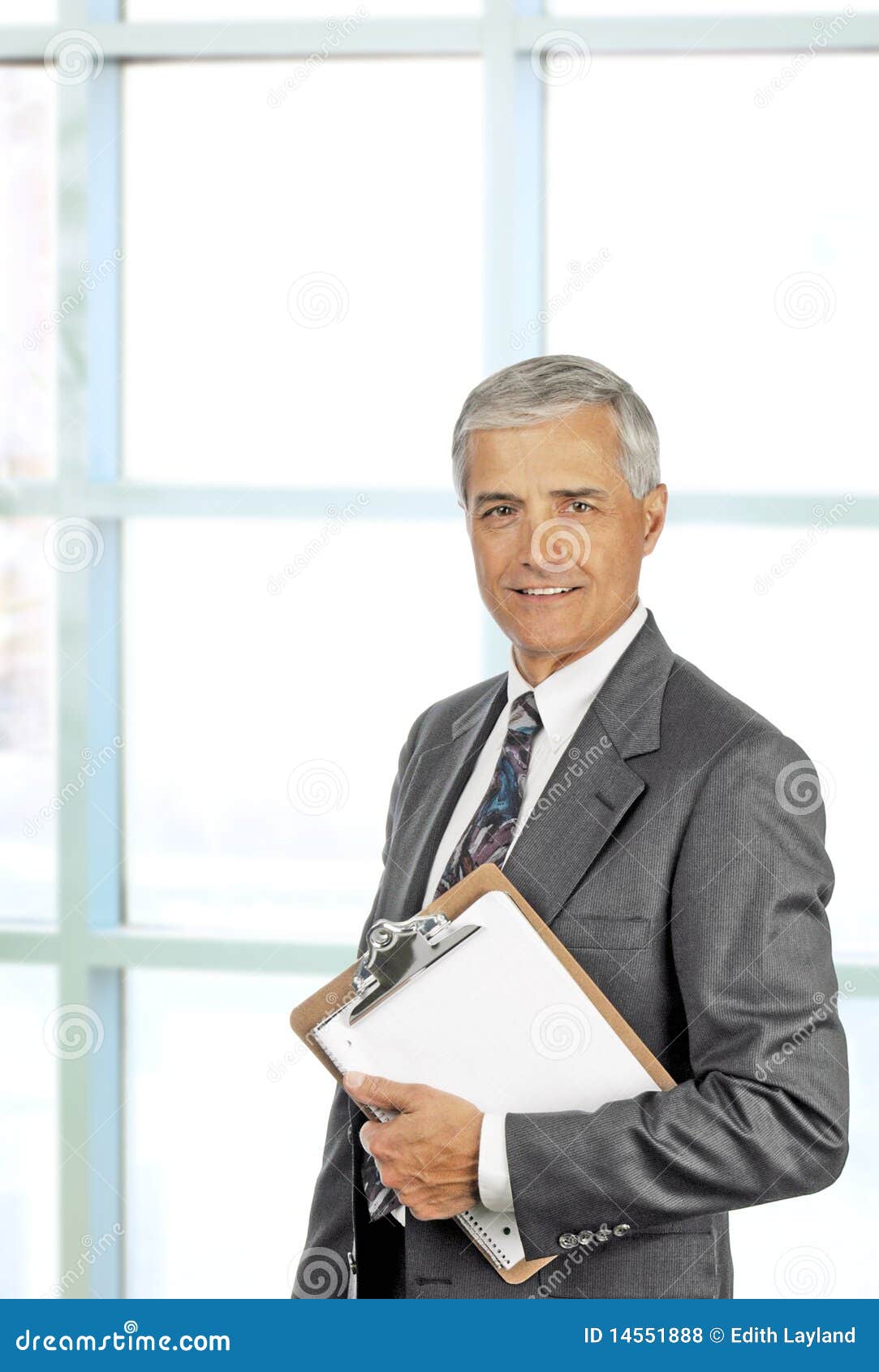 Smiling Senior Male Executive with Clipboard Stock Photo - Image of ...