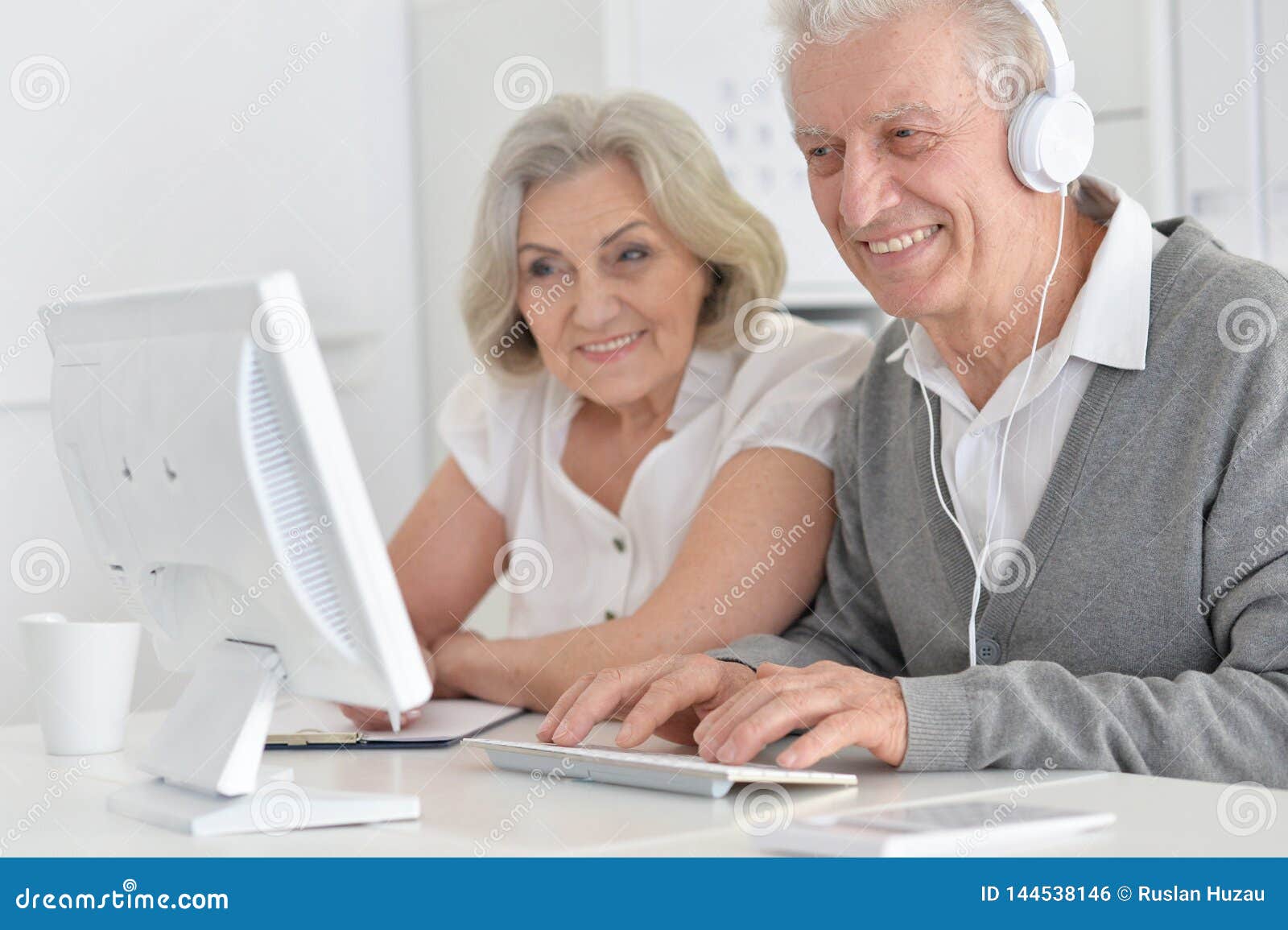 Portrait of Smiling Senior People Working with Computer at Home Stock ...