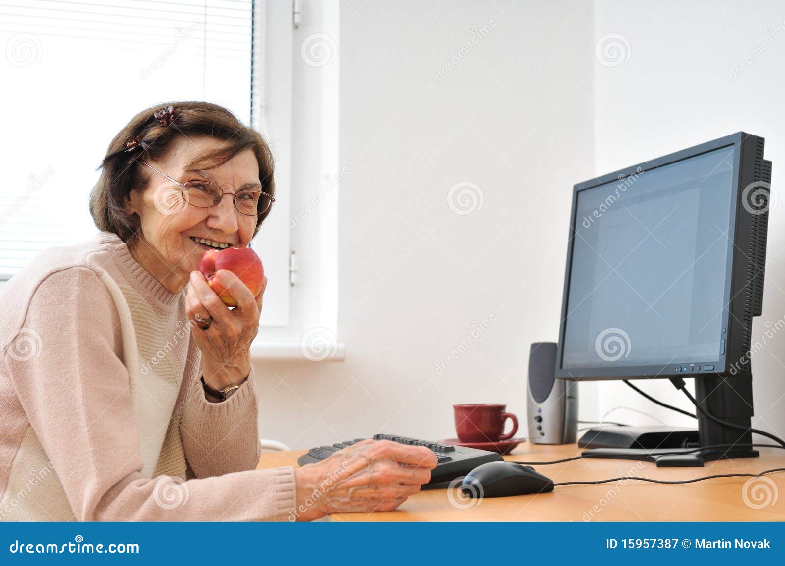 Smiling Senior Woman at Computer Stock Image - Image of apple, life ...