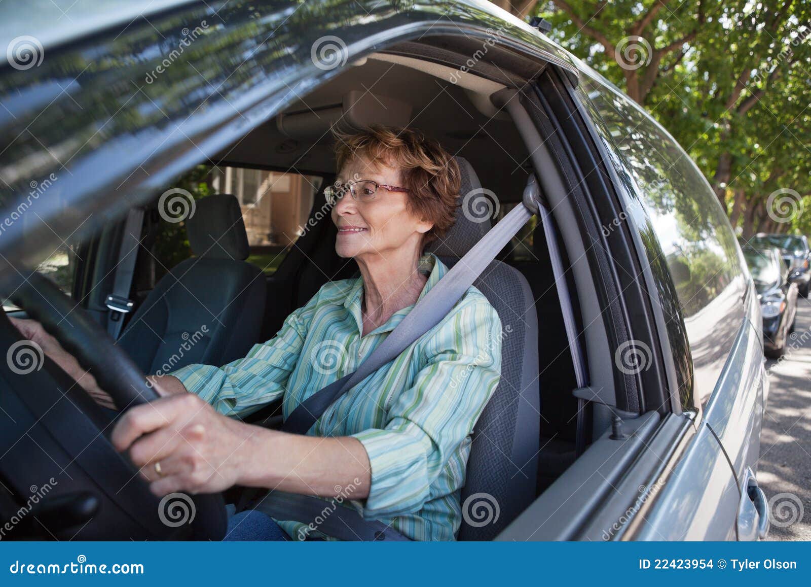 Smiling Senior Woman Driving Car Stock Photo - Image: 22423954