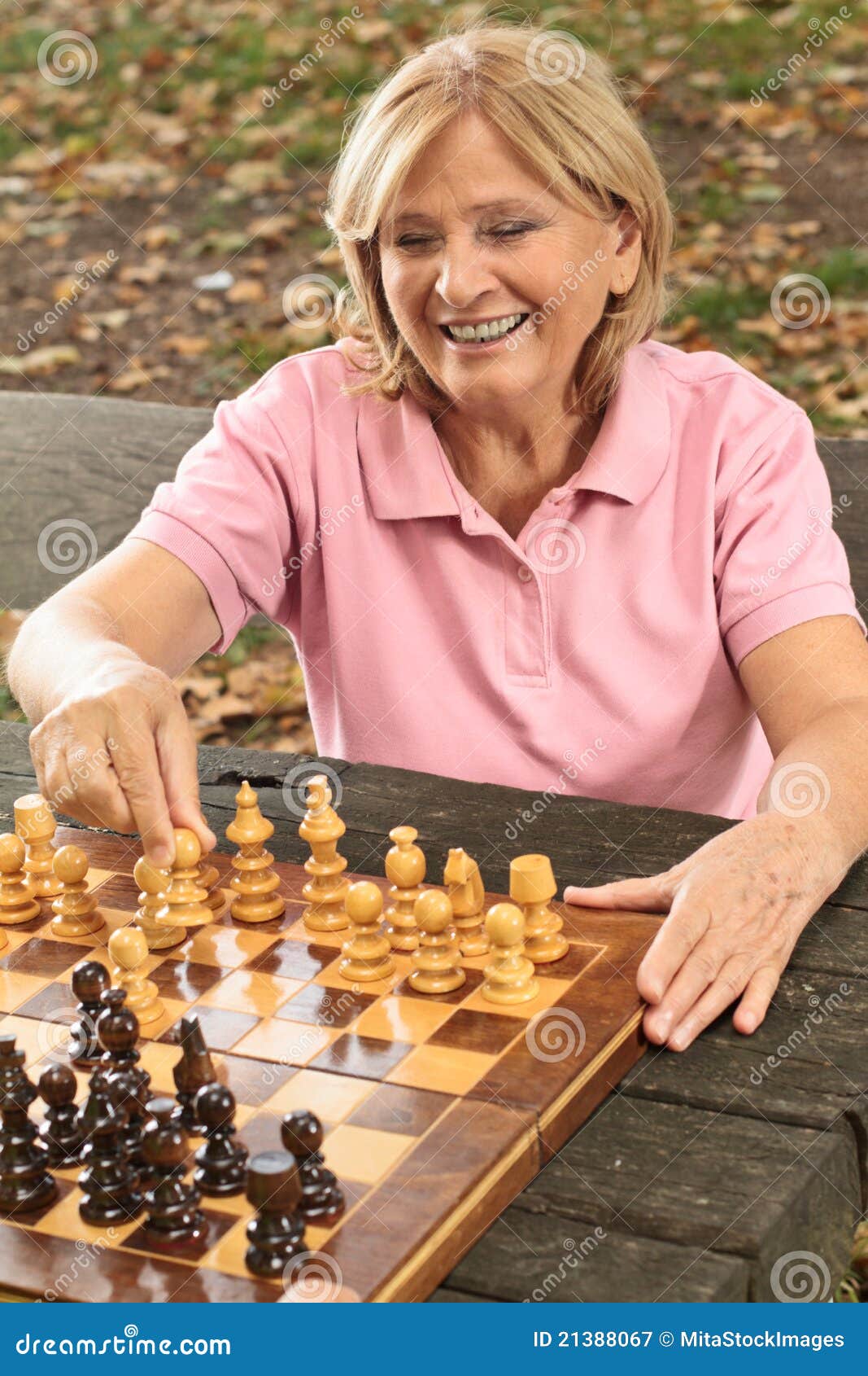 Smiling Senior Woman Playing Chess Stock Image - Image of mature ...
