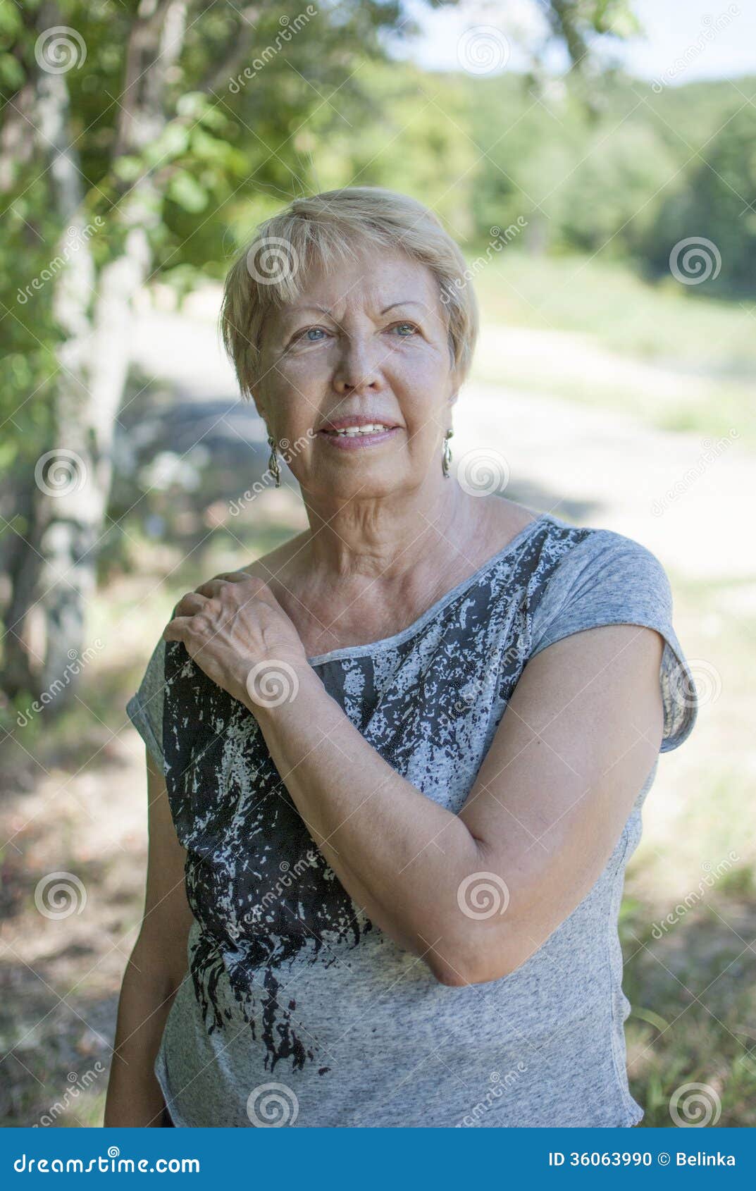 Smiling Senior Woman Walking in the Park Stock Photo - Image of light ...