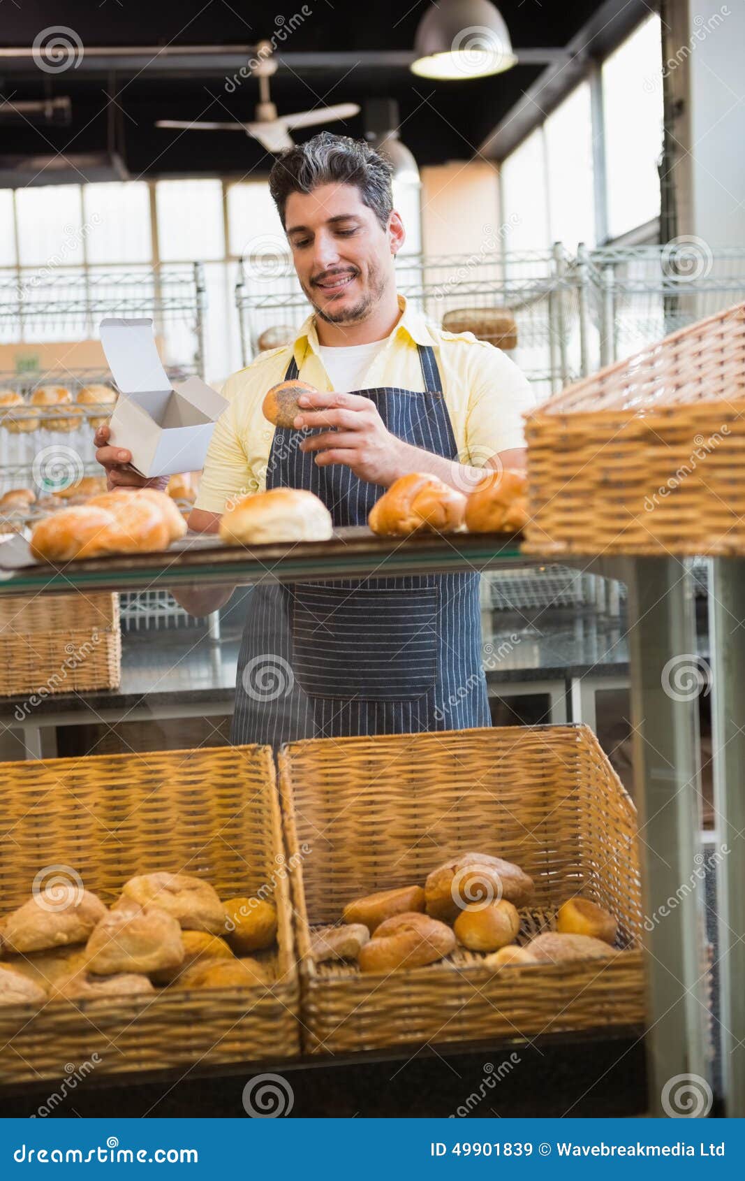 Smiling Server Holding Bread and Box Stock Image - Image of lifestyle ...