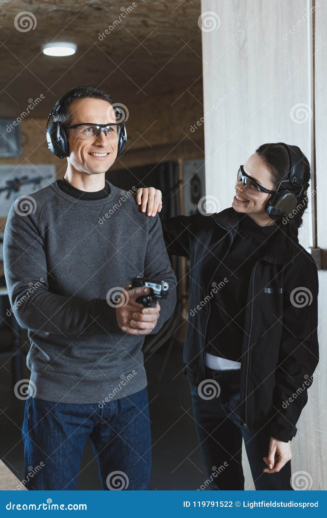 Smiling Shooting Instructor Supporting Client Stock Photo - Image of ...