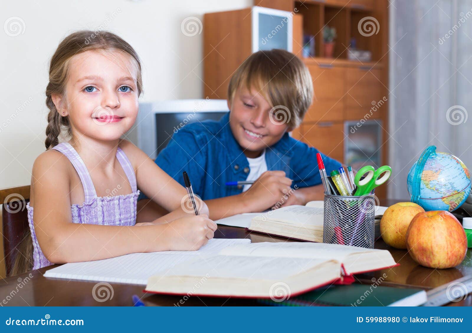Smiling Siblings Doing Homework with Books Stock Photo - Image of ...