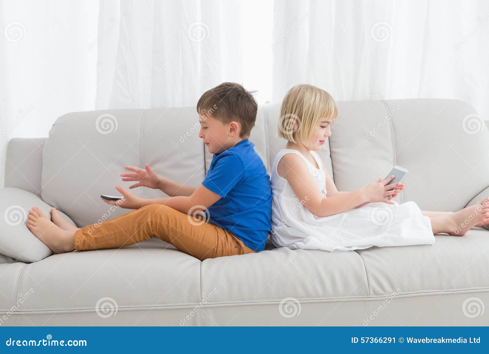 Smiling Siblings Using Mobile Phone Stock Image - Image of brother ...