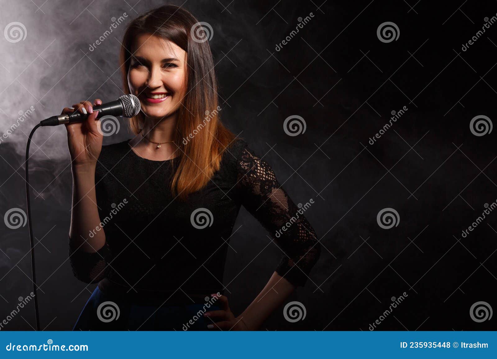 Smiling Singer Holding Microphone, Performing Tunes, Studio Background ...