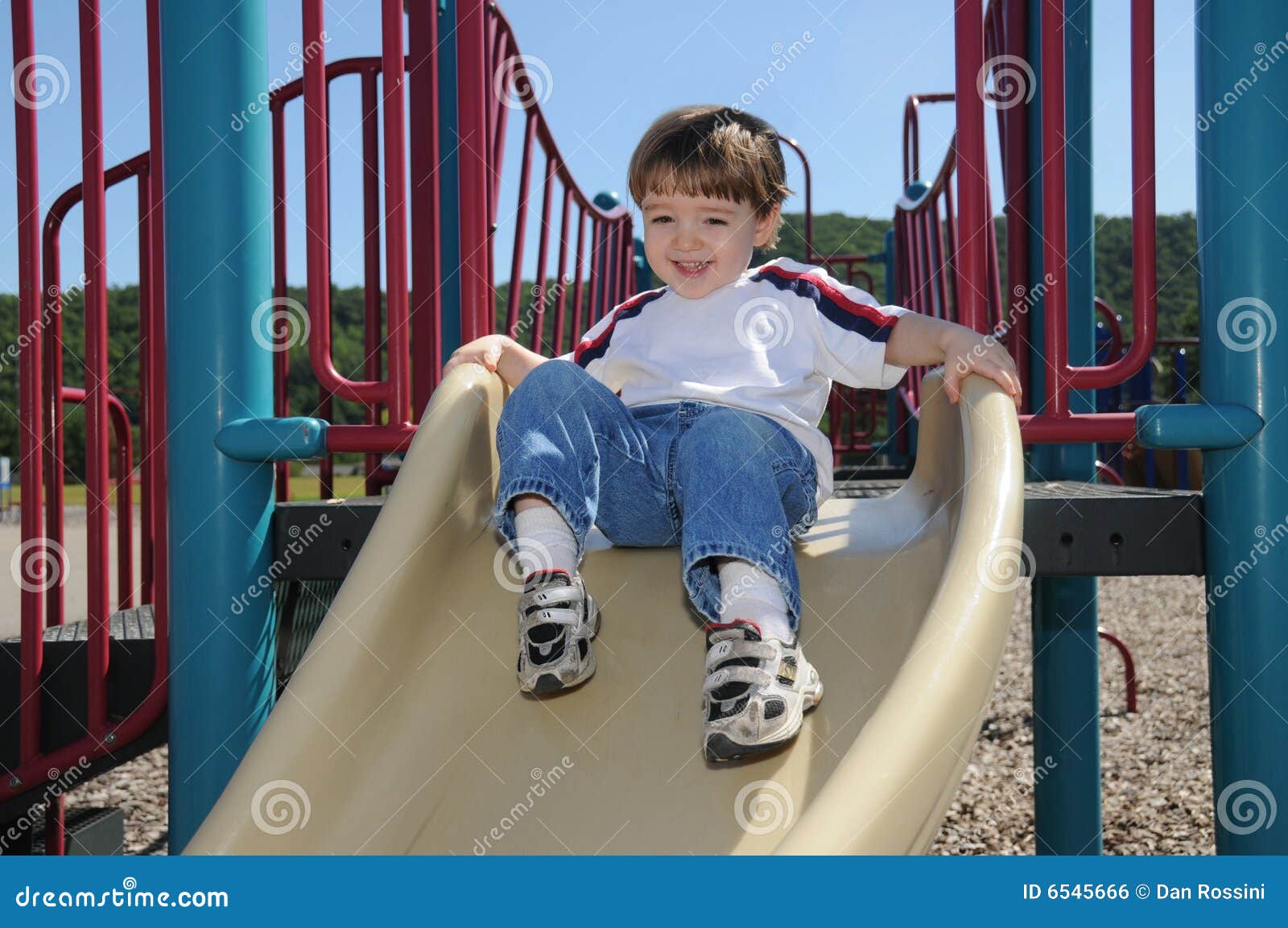Smiling and sliding stock photo. Image of excitement, little - 6545666