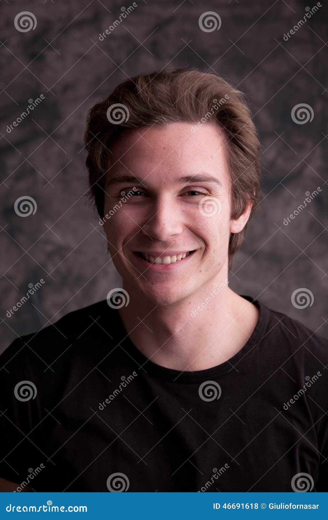 Smiling Smart Guy on a Grunge Black Background Stock Photo - Image of ...