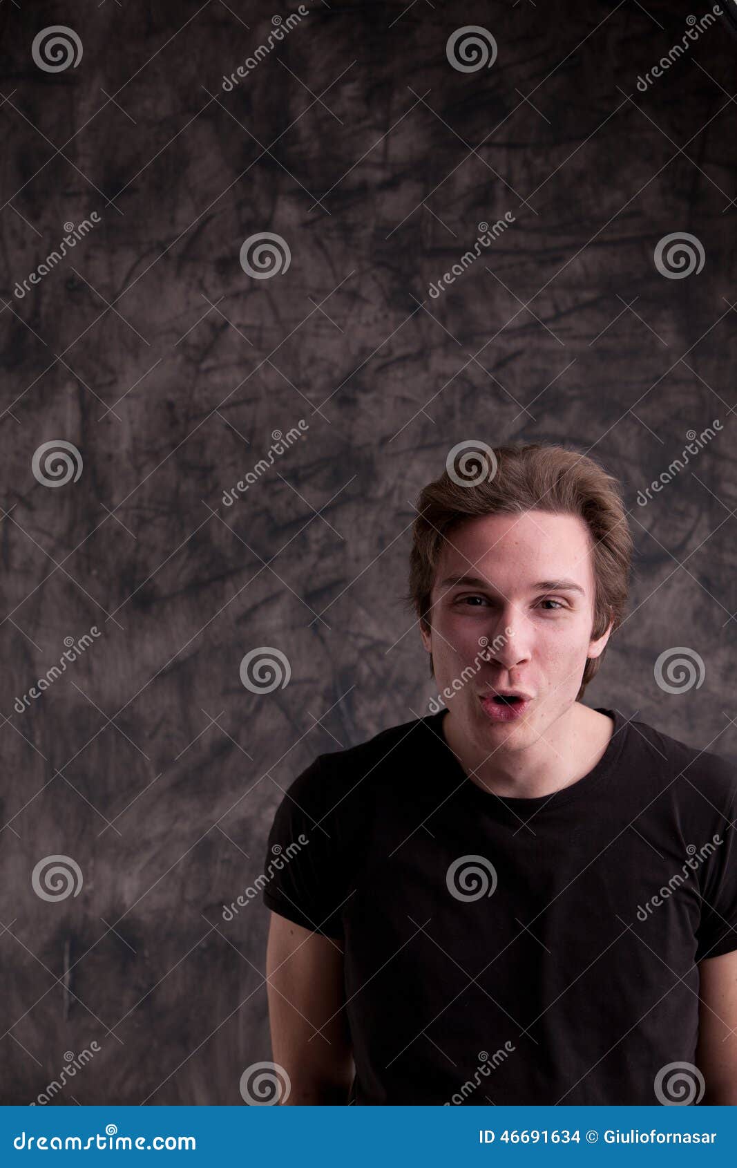 Smiling Smart Guy on a Grunge Black Background Stock Photo - Image of ...